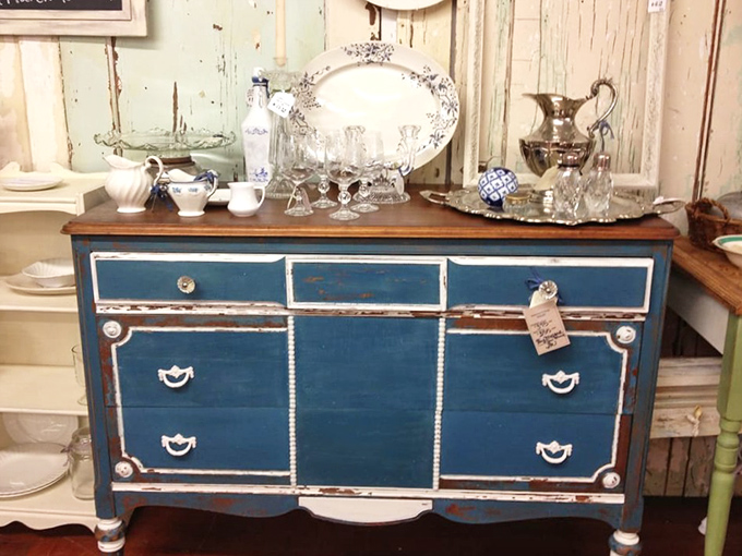 This distressed blue dresser isn't just furniture&mdash;it's a statement piece that says "I have excellent taste and know where the good stuff is."