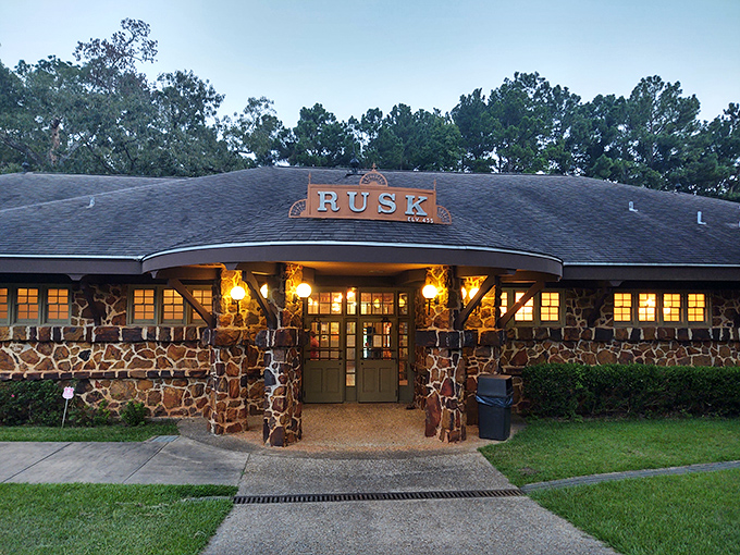 As dusk settles, the Rusk depot glows with warm invitation, its stone walls holding a century of whispered farewells and joyful reunions.