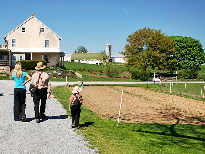Three generations walking the same path&mdash;literally and figuratively&mdash;as farming wisdom passes down with each step toward the fields.