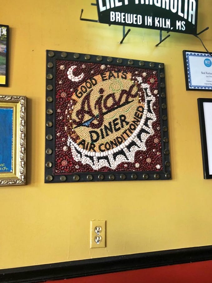 The bottle cap art on the wall isn't just decoration &ndash; it's a shrine to good times had and good times coming. Pure Oxford magic.
