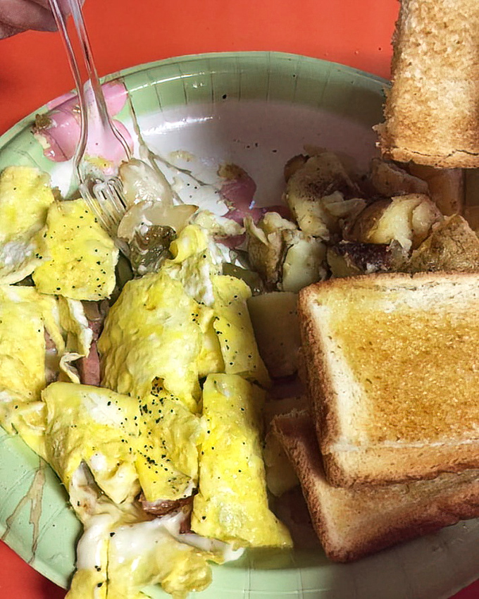 A western omelet that would make any diner proud &ndash; fluffy eggs folded around ham and vegetables, with toast standing by for clean-up duty.