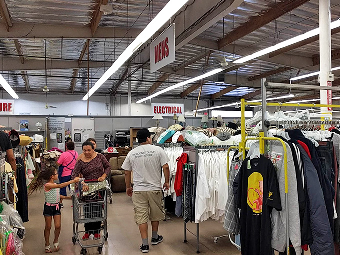 Department signs hover like street signs in this indoor neighborhood of bargains, guiding shoppers through this well-organized labyrinth.