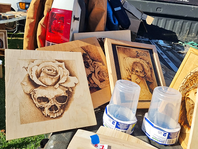 Wood-burned artistry transforms simple panels into conversation pieces&mdash;that skull-and-rose creation practically screaming "man cave masterpiece" to passing shoppers.