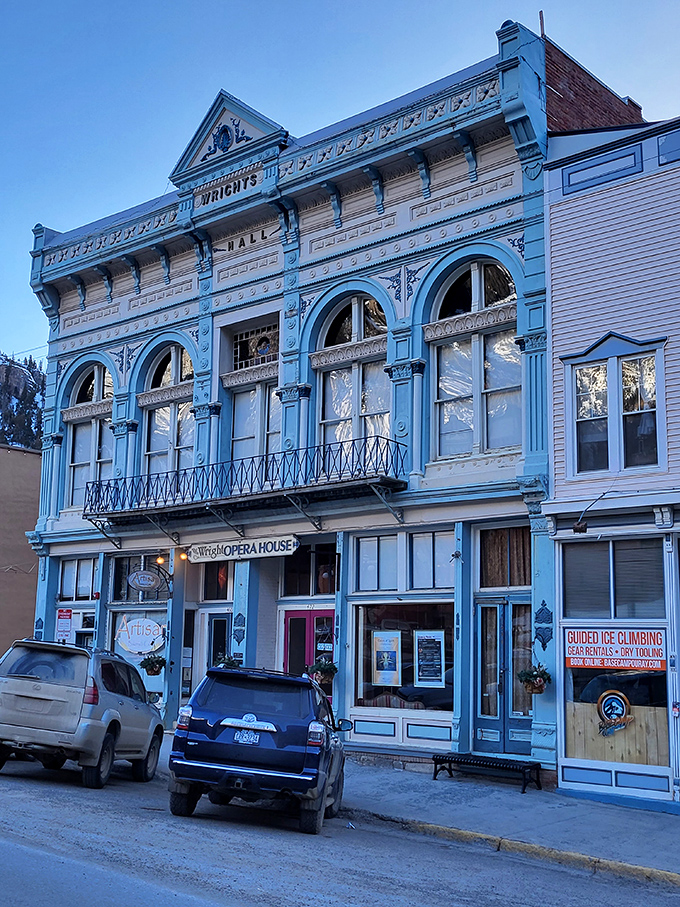 The Wright Opera House—a blue Victorian beauty that's seen more drama off-stage than on. Those arched windows have stories to tell.