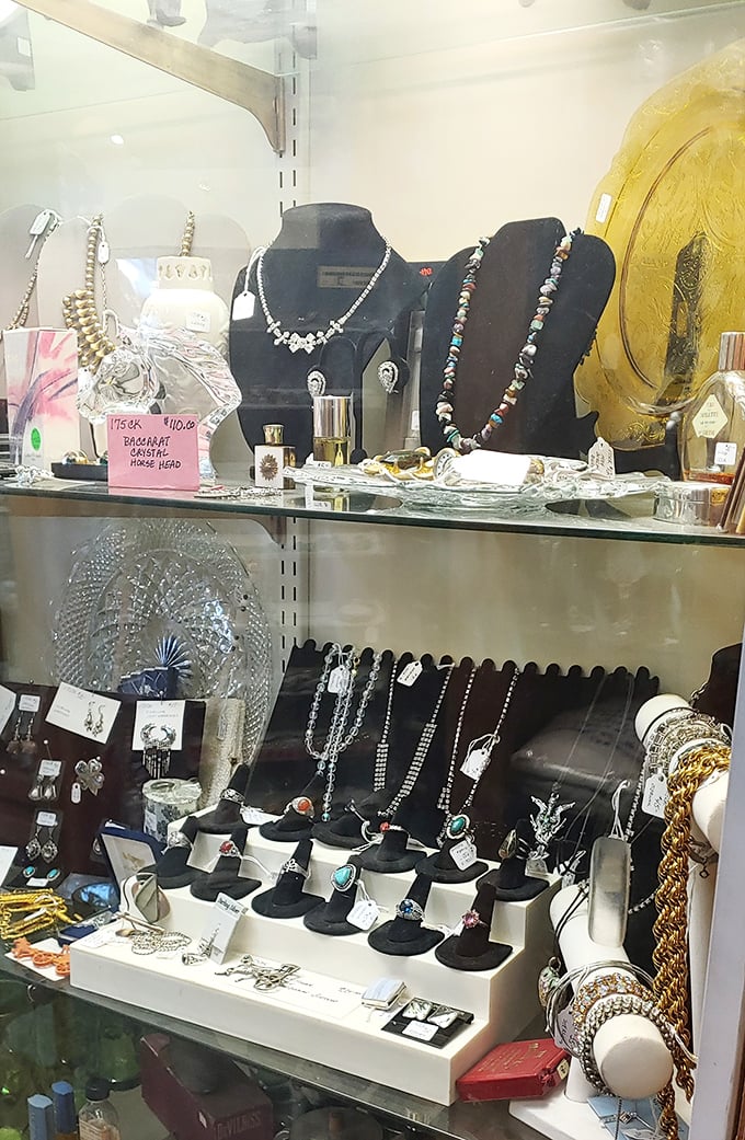 Jewelry displays where vintage rhinestones sparkle with the same enthusiasm as their diamond counterparts, waiting for their second act on new wrists and necks.