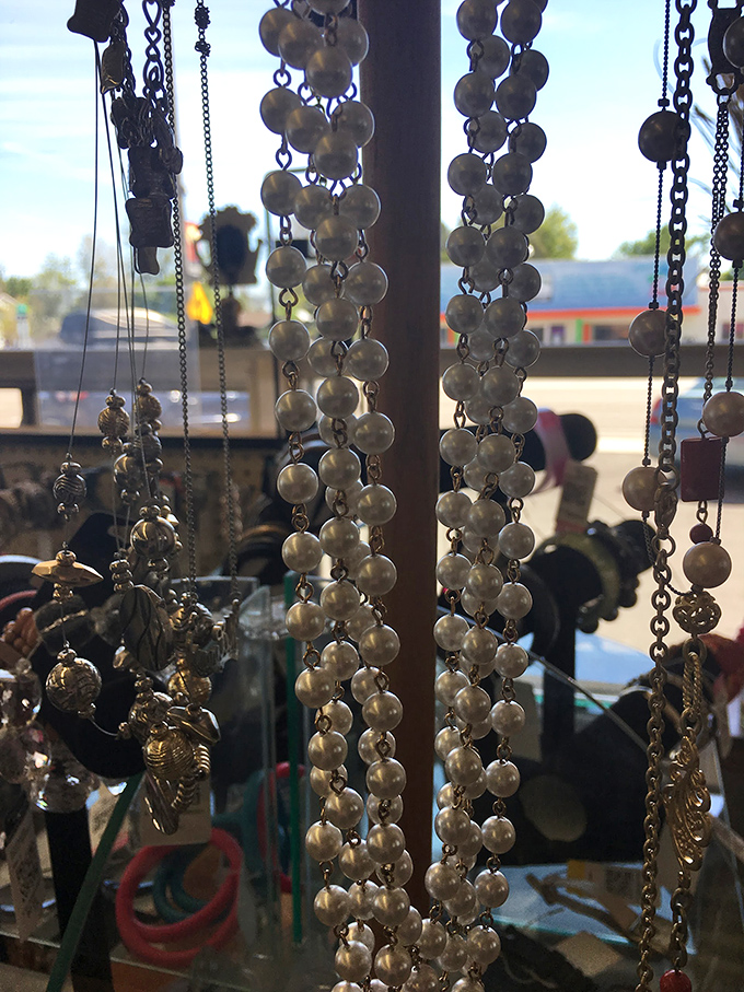 Costume jewelry dangles like treasure waiting to be discovered. One person's discarded necklace becomes another's statement piece at a fraction of retail.