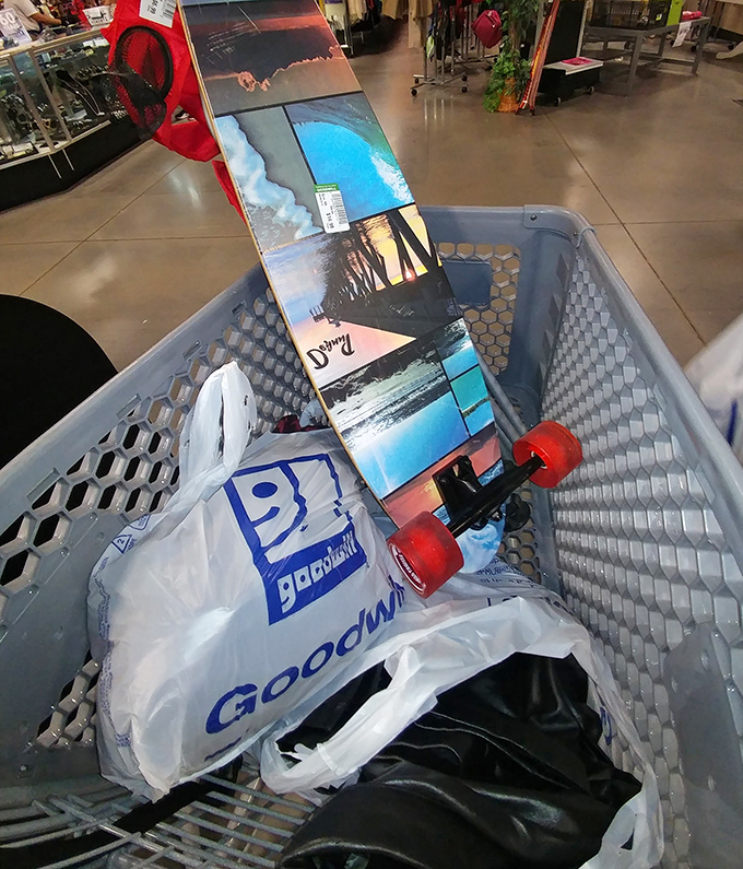 The victory lap: a skateboard and shopping bags nestled in the cart. Mission accomplished, wallet still intact.