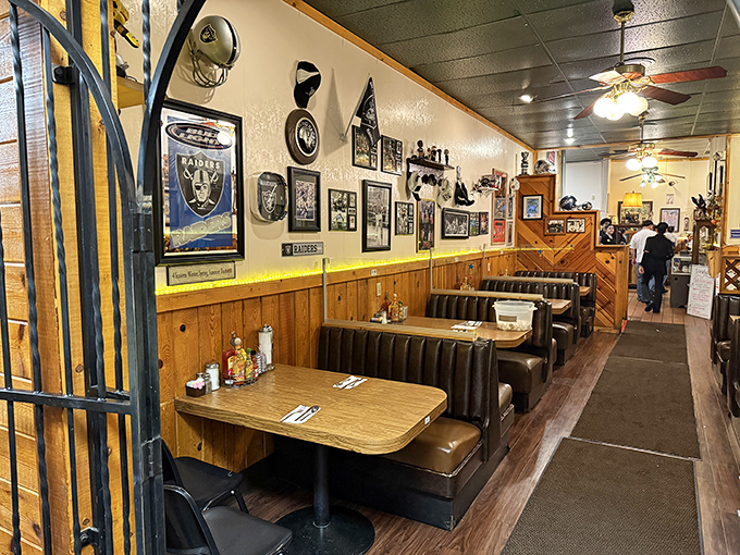 Sports memorabilia and wood paneling create that perfect "breakfast at your favorite uncle's cabin" vibe we all secretly crave.
