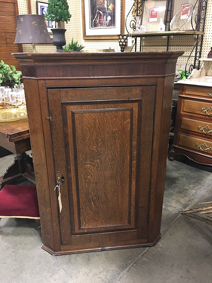 A corner cabinet so majestic it demands its own ZIP code. Not furniture&mdash;a family heirloom waiting to happen.