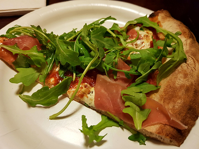 Prosciutto and arugula pizza &ndash; where peppery greens and salty cured ham create the perfect dance partners atop that heavenly crust.