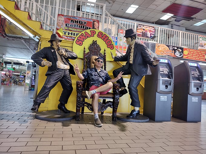 The Blues Brothers stand guard at this quirky photo op, proving that at the Swap Shop, even the ATMs come with a side of theatrical flair.