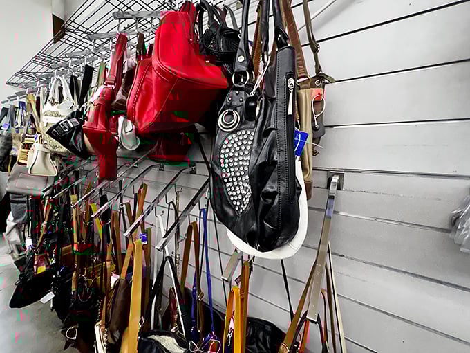 The handbag wall &ndash; a leather and vinyl tapestry where designer knockoffs hang alongside genuine vintage finds. The red one is practically winking at you.