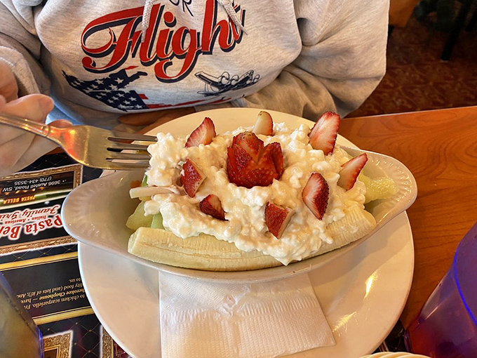 A banana split reimagined&mdash;fresh fruit, cottage cheese, and strawberries creating a breakfast that thinks it's dessert.