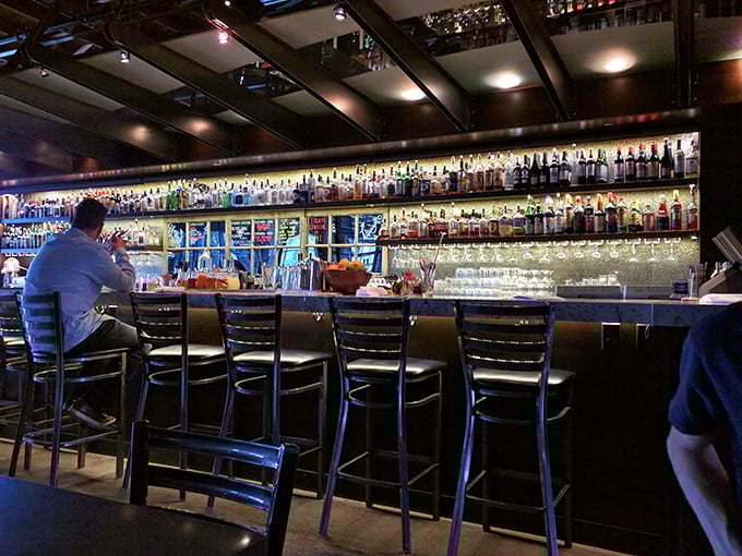 The bar isn't just stocked&mdash;it's a liquid library of possibilities. Those backlit bottles promise cocktail adventures worthy of your most sophisticated friends.