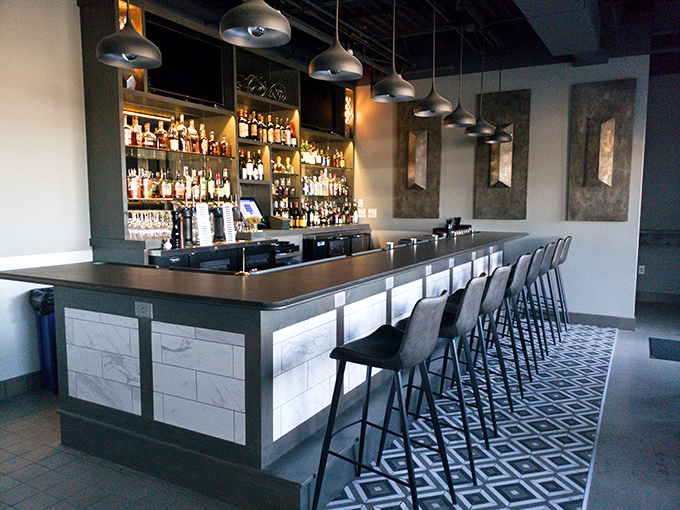 A bar that means business, with enough bottles to make you wonder if you should just start working your way alphabetically through them.