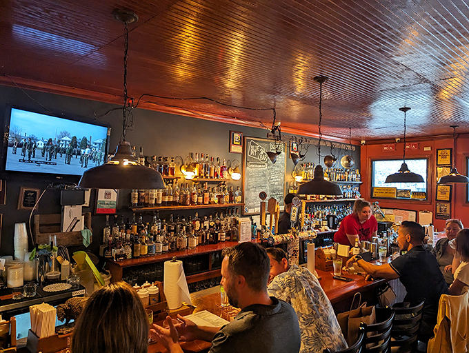 The bar isn't just stocked—it's curated. A whiskey collection that would make bourbon country blush, waiting to complement your smoky feast.