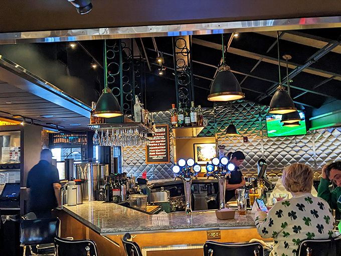 The bar area gleams with possibility, where skilled bartenders craft drinks with the precision of Swiss watchmakers and the flair of Broadway performers.