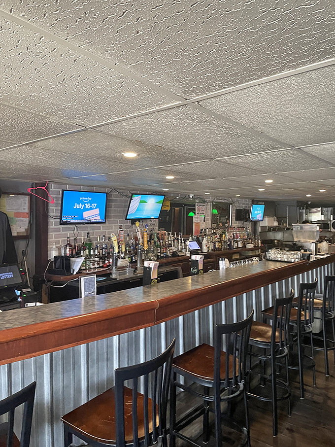 A well-stocked bar with corrugated metal accents strikes that perfect balance between rustic charm and "yes, we can make that cocktail."