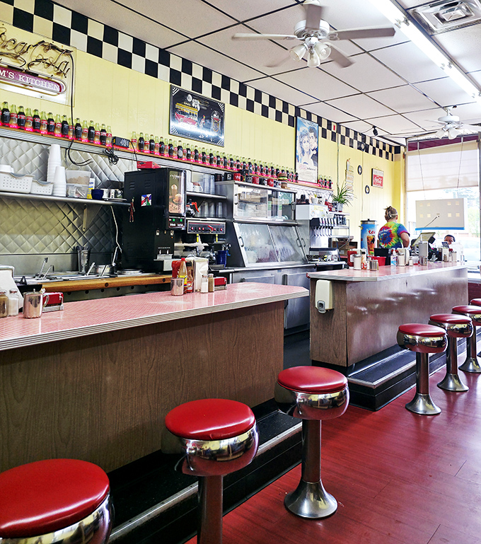 The classic diner counter with its row of fire-engine red stools&mdash;each one a front-row seat to culinary theater.