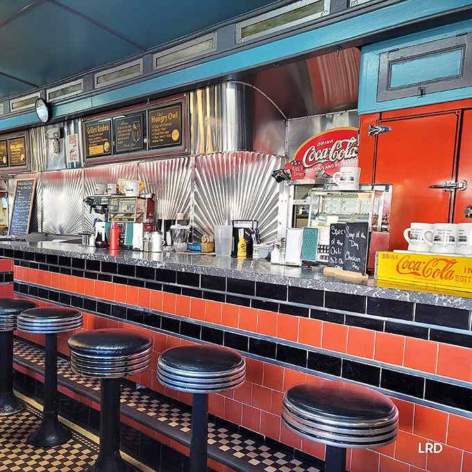 Counter culture at its finest &ndash; those classic stools, stainless steel backsplash, and vintage Coca-Cola fridge create the diner trifecta of nostalgia.