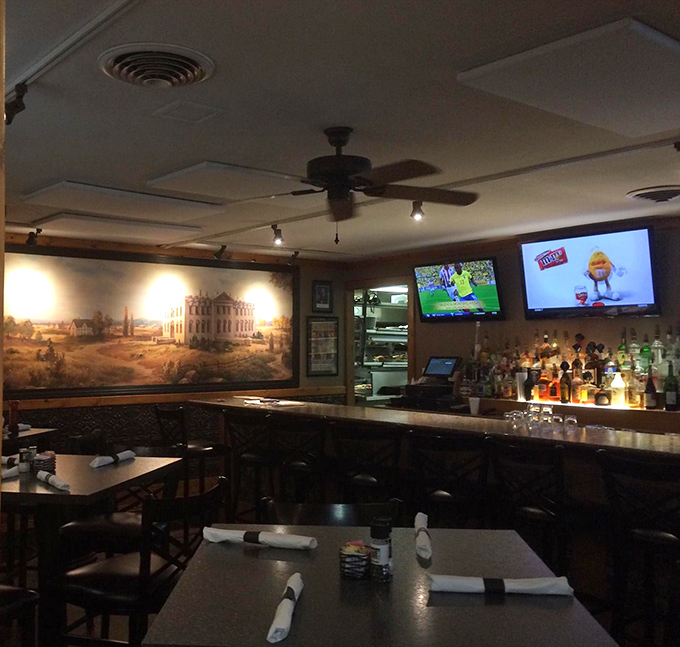 The bar area where sports on TV and historical artwork create the perfect backdrop for decision-making about dessert.
