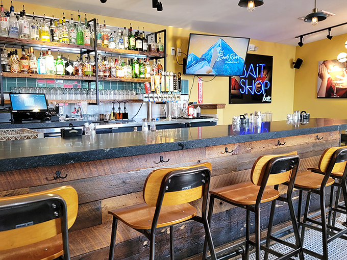 A bar that understands sometimes you need a little something with your sandwich. The wood paneling adds warmth that no interior designer could replicate.