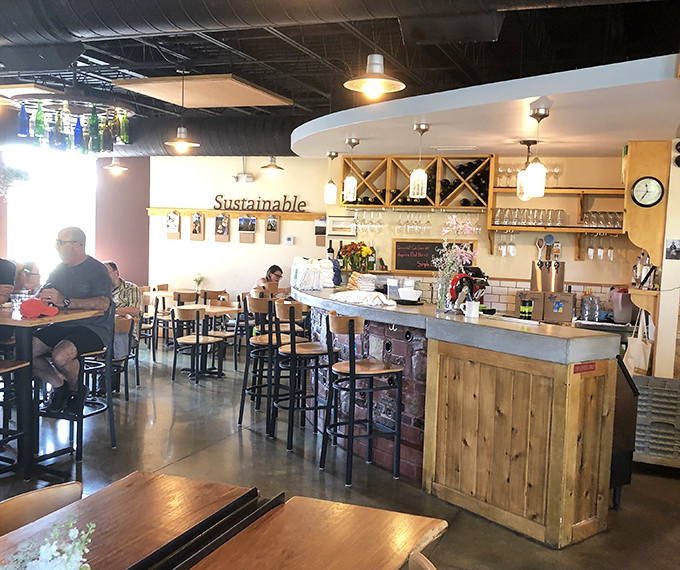 The bar area proudly displays its "Sustainable" ethos, proving good food can be good for the community too.