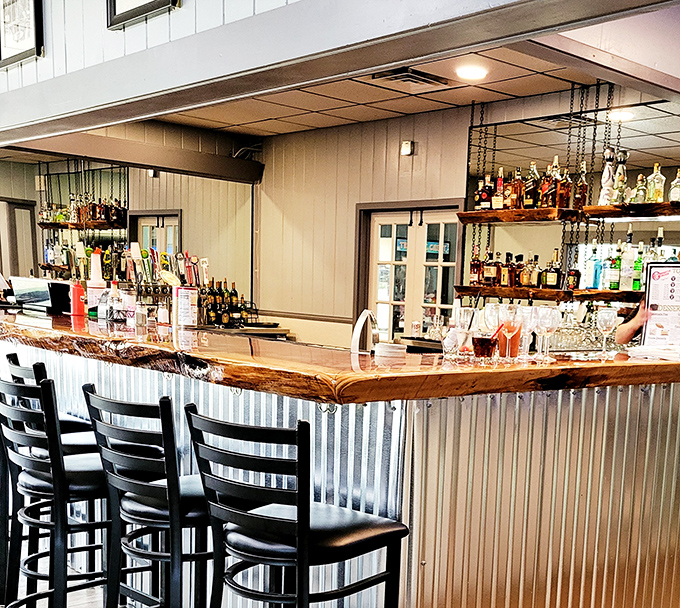 The bar's live-edge wood countertop adds rustic charm to this surprisingly sophisticated watering hole. Cocktail hour in Paradise!