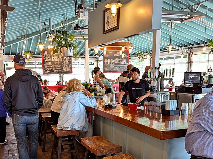 The bustling bar area where happy hour dreams come true. Those chalkboard specials are actually treasure maps leading to culinary gold.