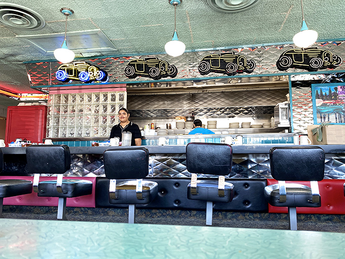 The counter where breakfast dreams come true. Those vintage car decorations aren't just nostalgia &ndash; they're promising to drive your taste buds to flavor town.