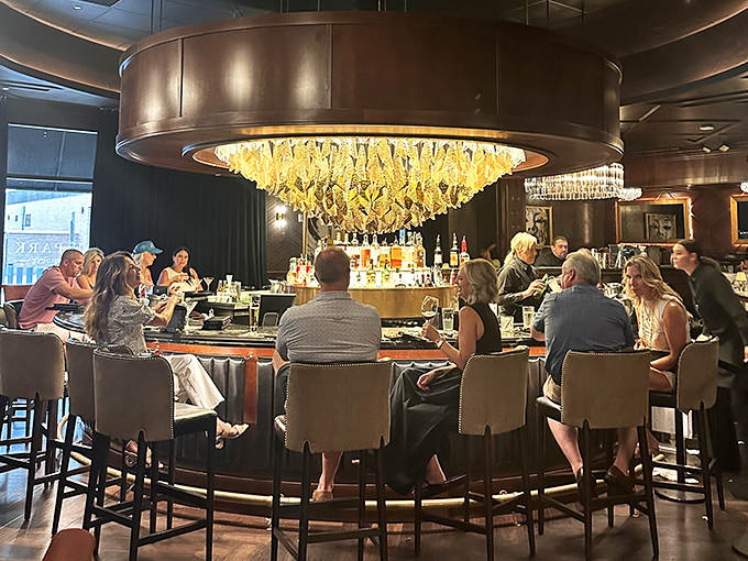 The circular bar serves as Hyde Park's social epicenter, where strangers become friends over perfectly chilled martinis and tales of exceptional meals past.