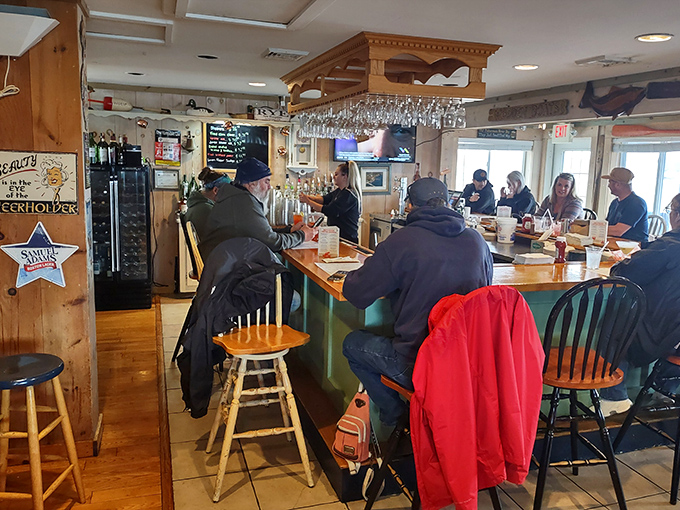 The bar area buzzes with conversation as regulars perch on stools, trading stories while waiting for their seafood fix. Some relationships here are older than the beer taps.