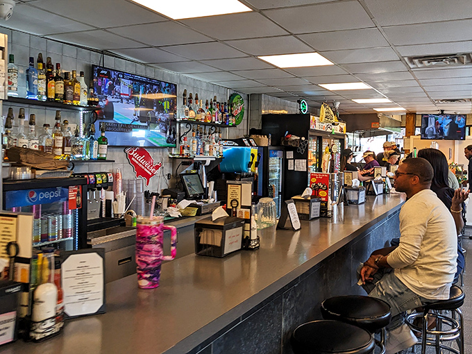 The bar area serves as command central, where sandwich dreams are ordered, crafted, and dispatched to eager hands.