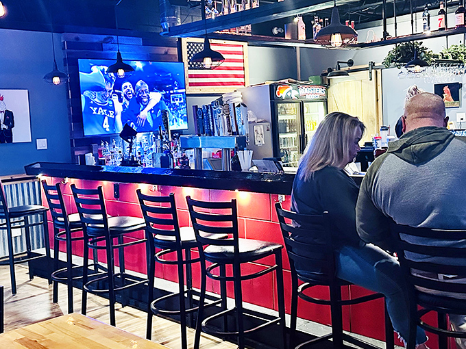 The bar area balances sports-watching with serious eating. That American flag says it all &ndash; few things are more patriotic than supporting local restaurants that do things right.