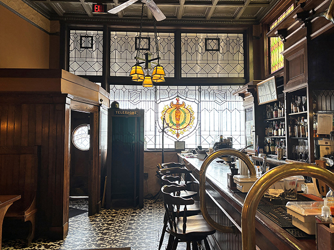 The bar area feels like it belongs in a classic film &ndash; stained glass, polished wood, and the promise of perfectly crafted cocktails to start your evening right.