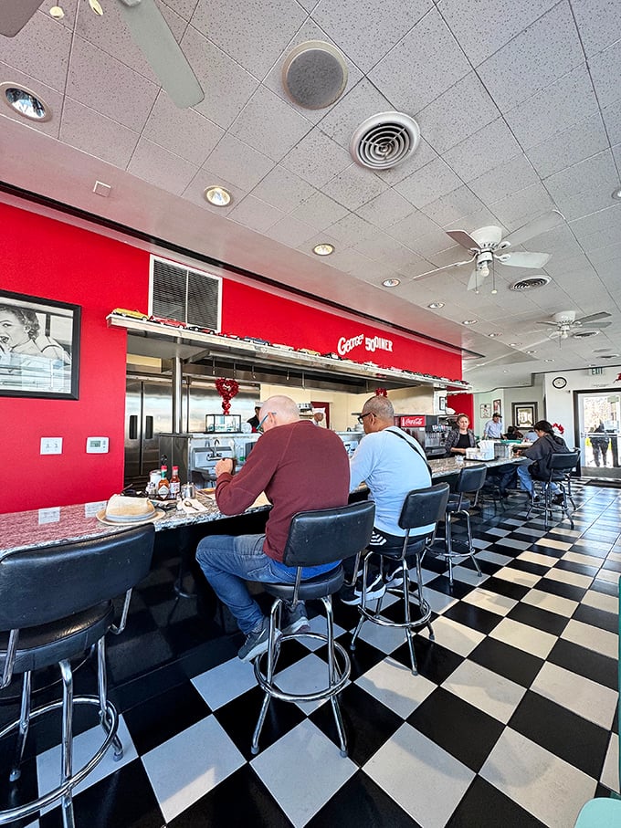 The counter seating offers front-row tickets to the short-order cooking show, where regulars exchange neighborhood news over bottomless coffee.