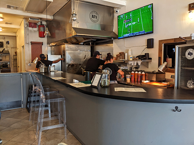 The open kitchen layout means you can watch your barbecue dreams become reality. The TV showing sports is just a bonus.