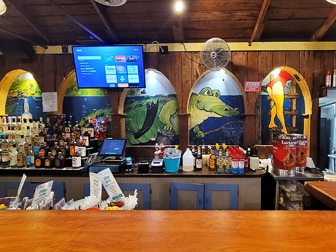 The bar's gator murals tell you everything you need to know: you're in Florida, you're among friends, and yes, that IS a cocktail in your future.