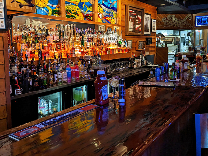 The bar gleams with amber bottles like a pirate's treasure chest, promising libations worthy of accompanying the kitchen's seafood bounty.