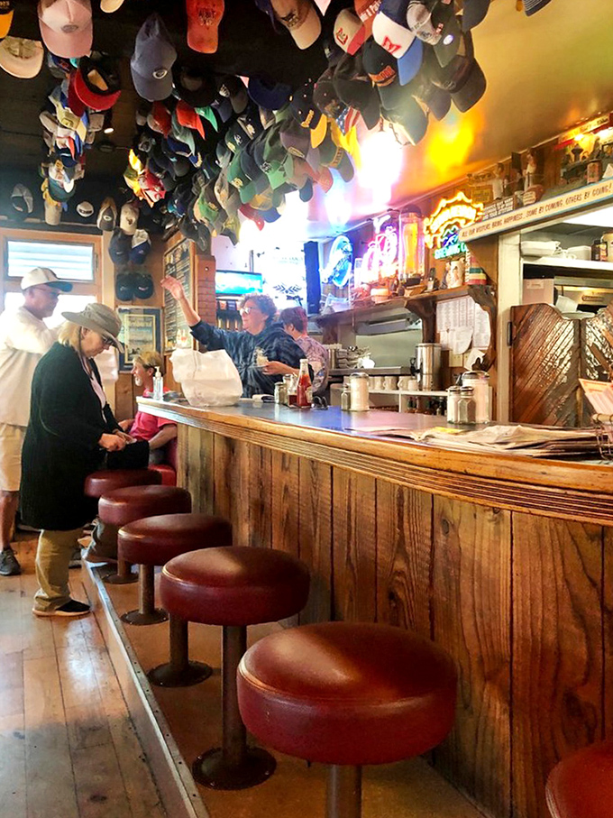 At this bar, the real entertainment isn't on those TVs&mdash;it's the ceiling's baseball cap collection, telling thousands of visitor stories without saying a word.