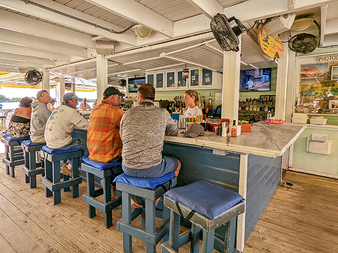 The regulars' perch: where bartenders know your order before you sit down and the fish tales get taller with each round.