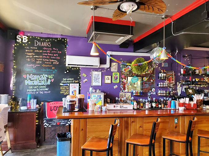 The bar area's vibrant purple walls and colorful chalkboard menu prove that breakfast joints can have personality without sacrificing soul or substance.