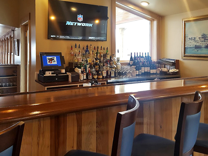 The bar area balances nautical charm with modern comfort&mdash;exactly where you want to sip something cold while waiting for your lobster roll.