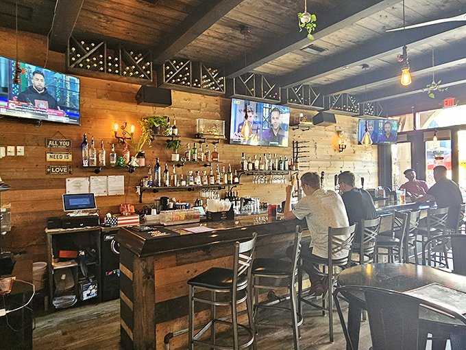 The rustic bar area balances sports-watching with serious eating&mdash;priorities perfectly aligned under wooden beams.