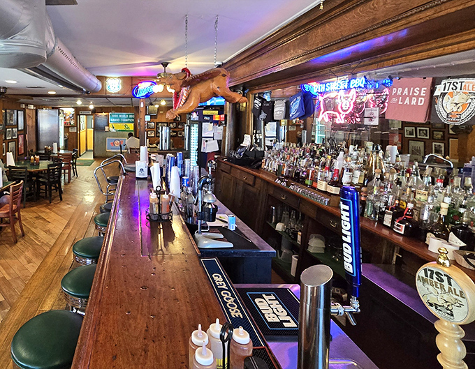 The bar area doesn't just serve drinks—it's a shrine to barbecue culture, complete with a flying pig watching over proceedings.