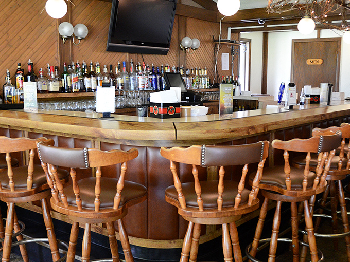 The horseshoe-shaped bar isn't just functional&mdash;it's the social heart of Blanck's, where strangers become neighbors over properly made cocktails.