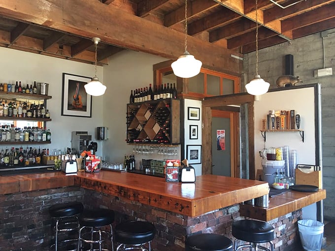 The bar at Podnah's &ndash; where bourbon and beer stand ready to complement your barbecue journey through the smoke-kissed promised land.