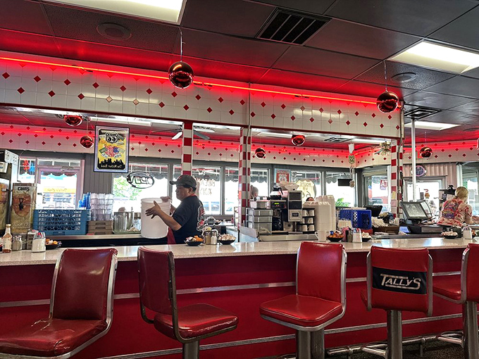 Counter seating: where solo diners become part of the show. Front-row tickets to the breakfast ballet, complete with coffee refills.