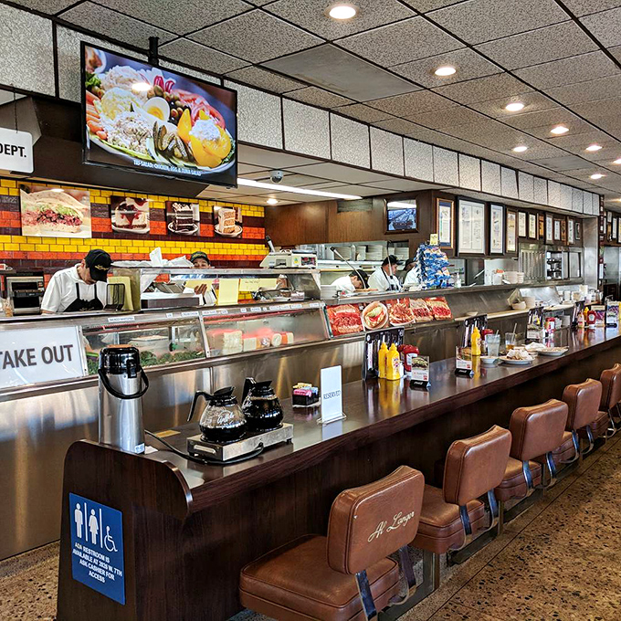 The counter where sandwich magic happens&mdash;like watching Olympic athletes, except the sport is pastrami slicing.