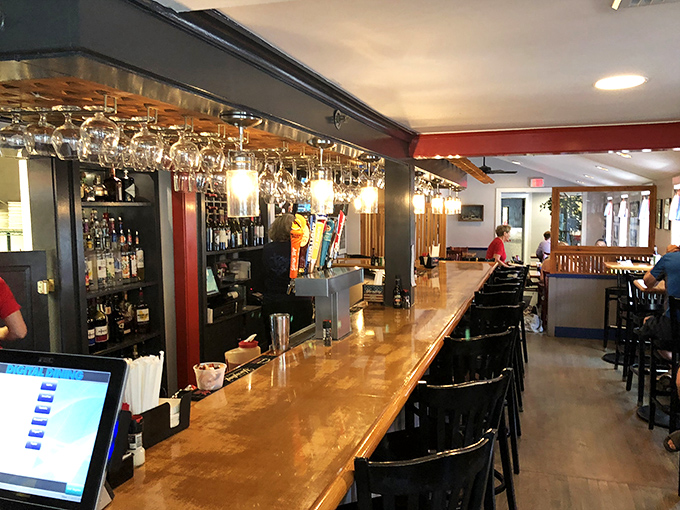 The polished bar beckons with promises of perfectly paired wines and ice-cold beers for every palate.